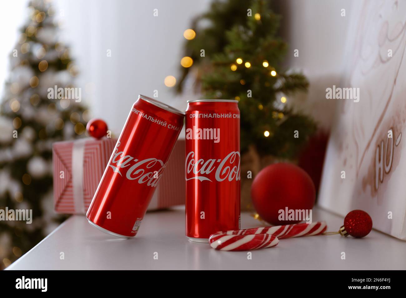 MYKOLAIV, UKRAINE - JANUARY 13, 2021: Cans of Coca-Cola in room ...