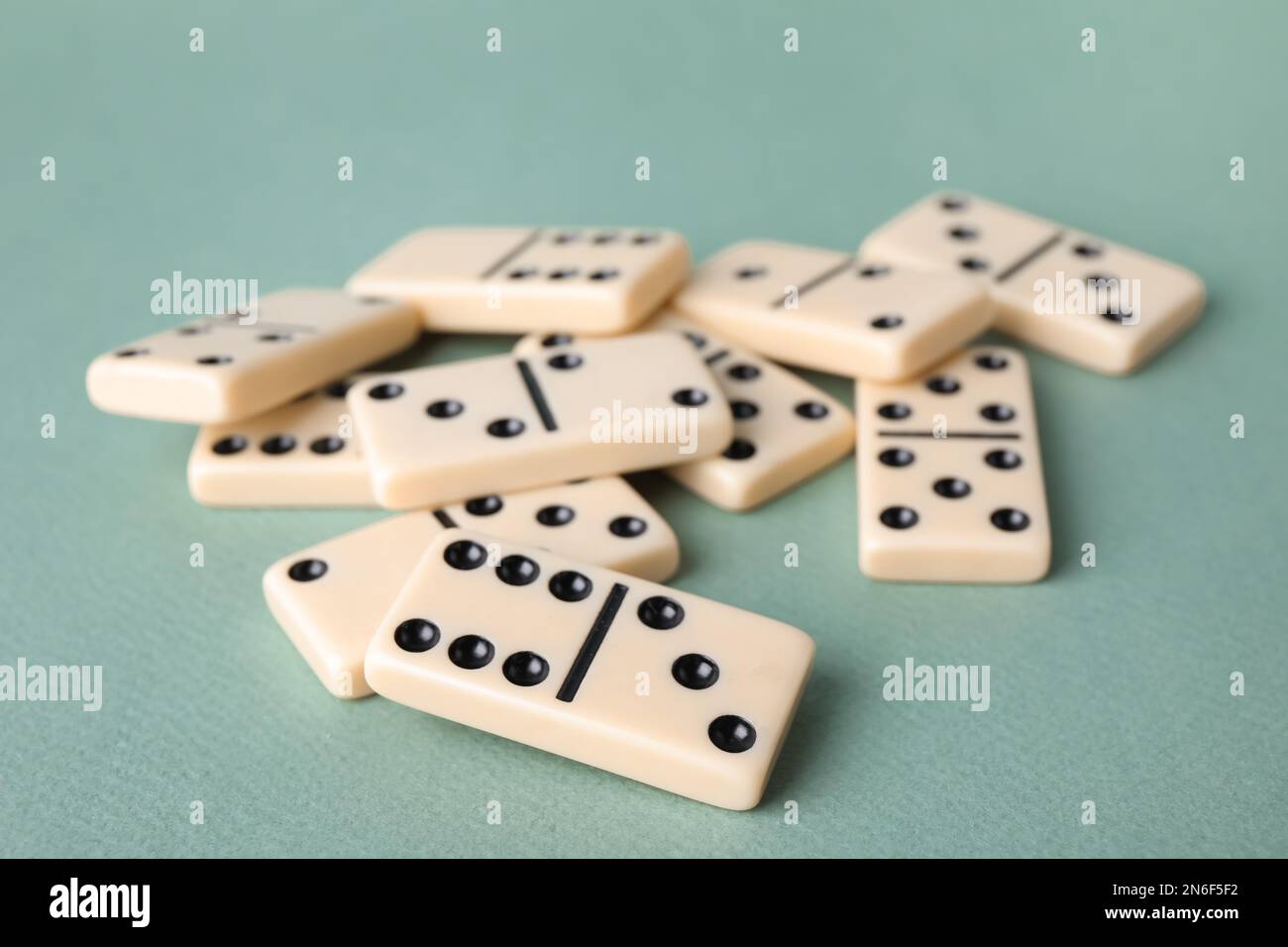 Pile of domino tiles on grey background Stock Photo - Alamy