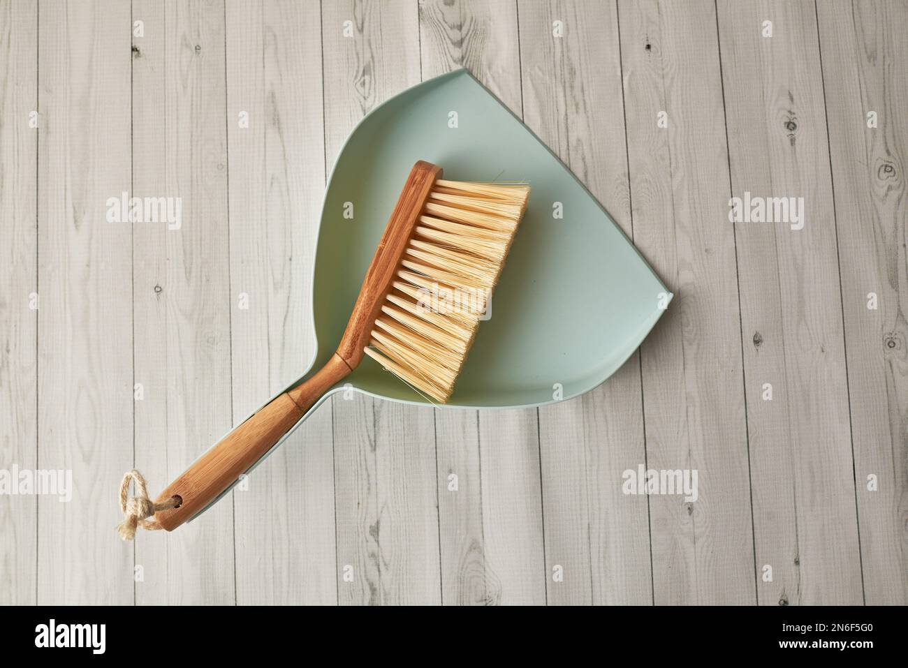 Sweeping Dust With A Broom On A Dustpan, Housekeeping Concept Stock ...