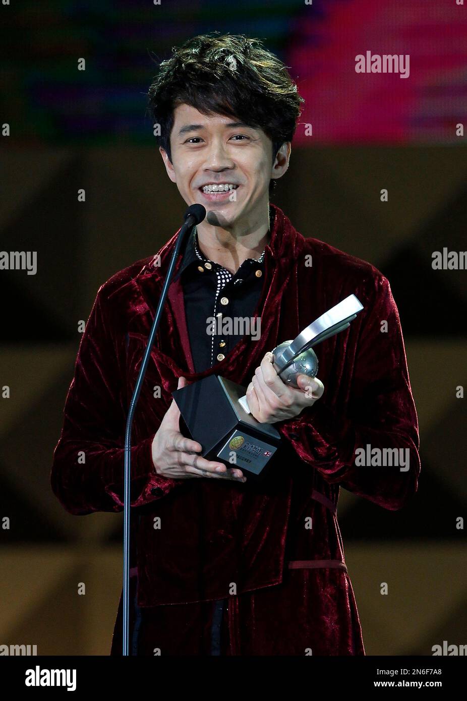 Malaysian singer Michael Wong speaks after receiving the Most Popular ...