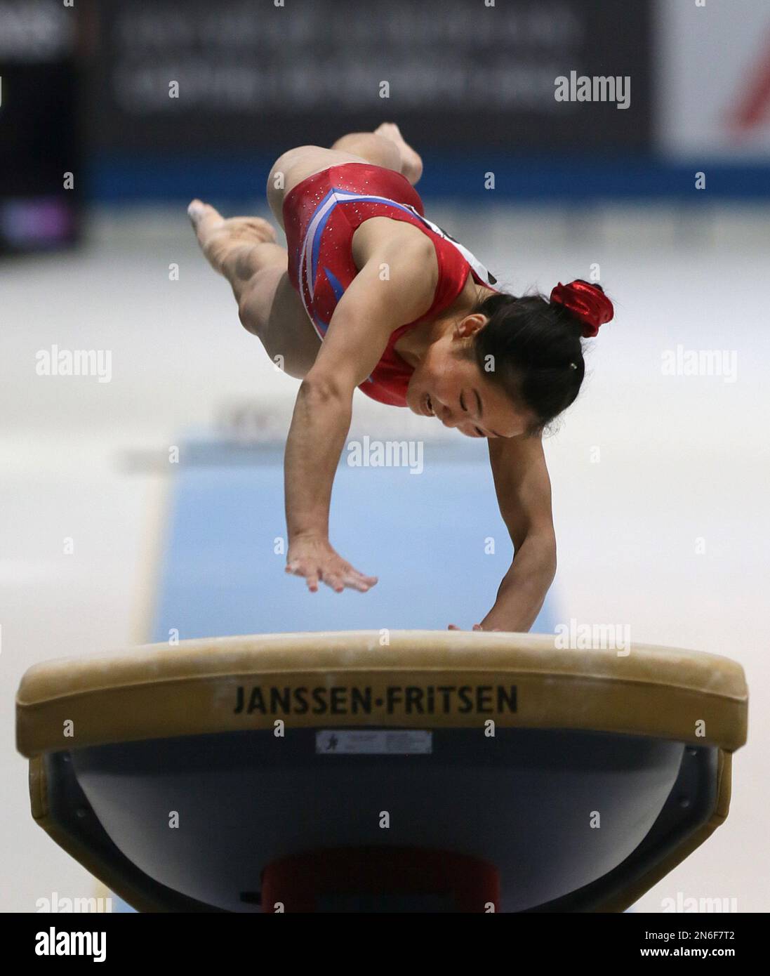 Hong Un-Jong competes in the vault during the apparatus final at the ...