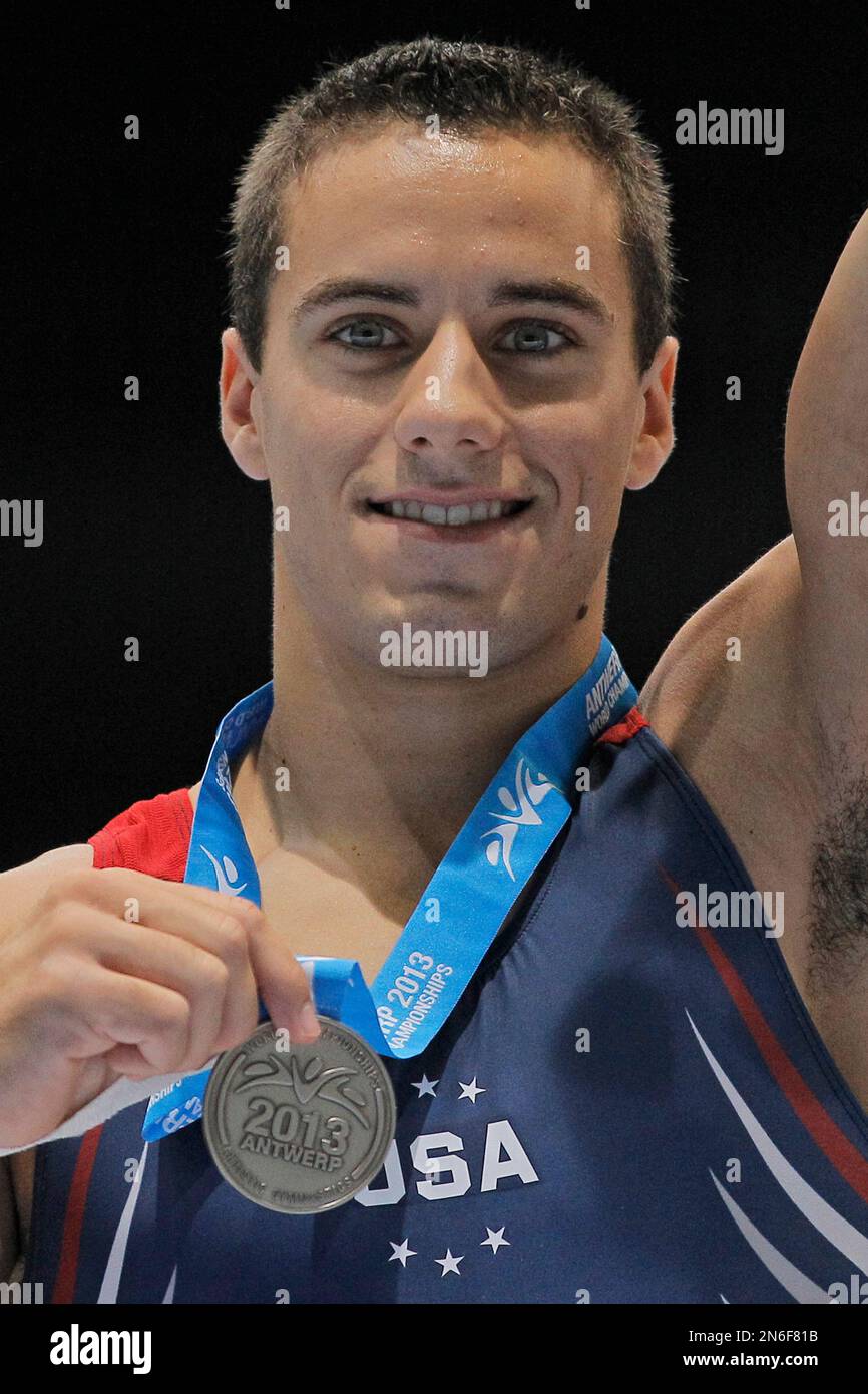 Jacob Dalton of the U.S. holds his silver medal after the floor ...
