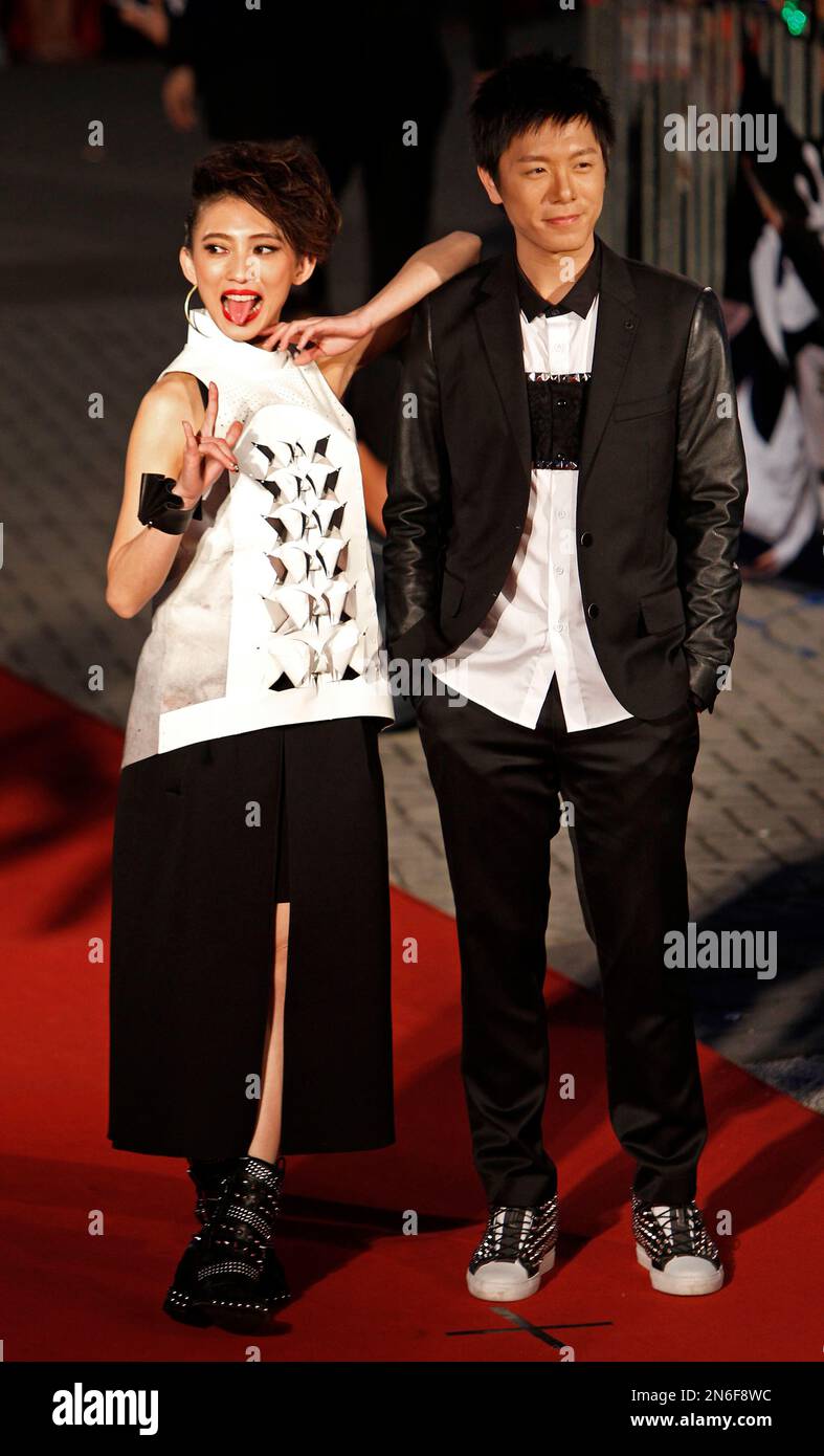Malaysian singer Penny Tai, left, and Taiwanese singer William Wei pose ...