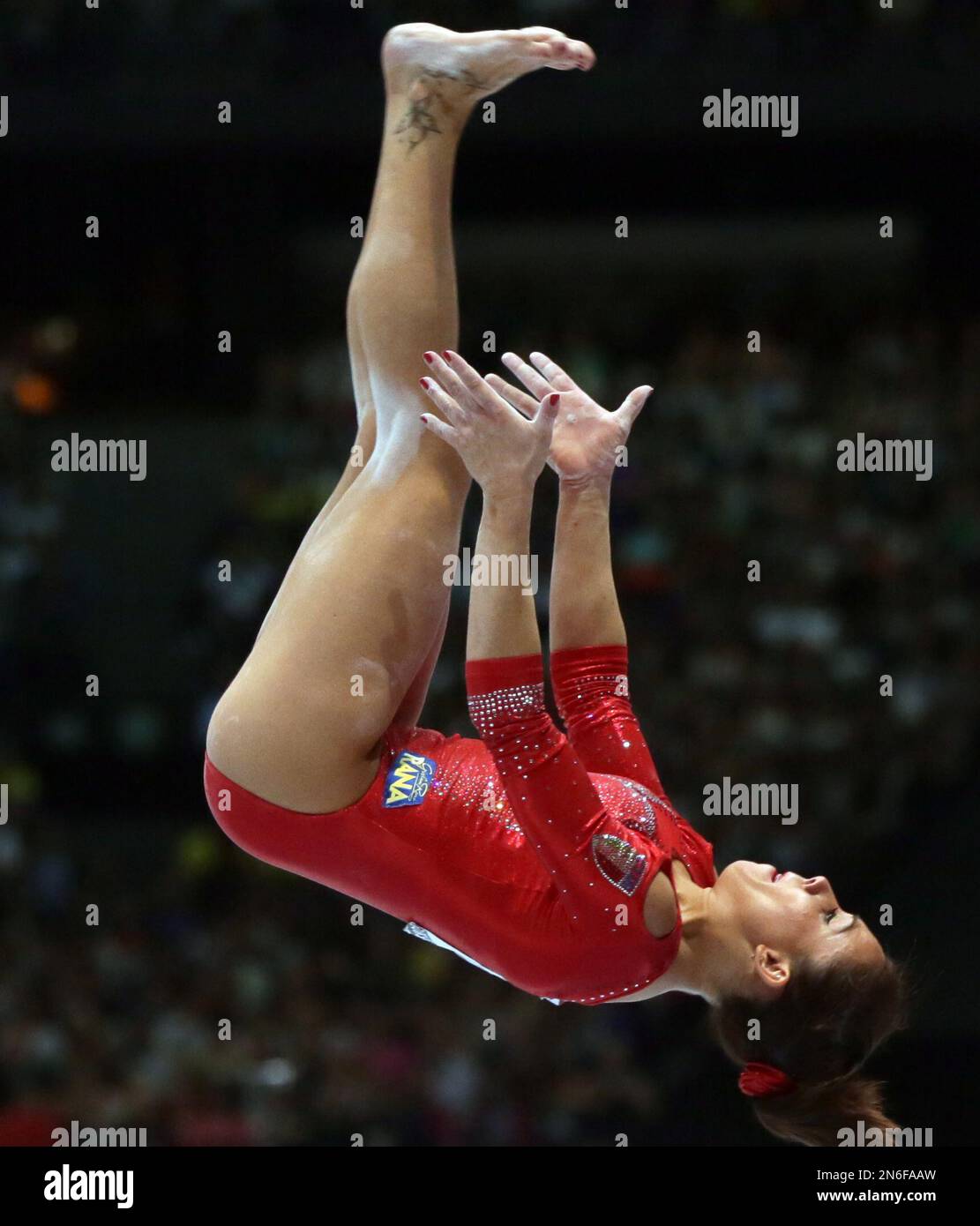 Italy's Vanessa Ferrari competes on the balance beam during an all ...