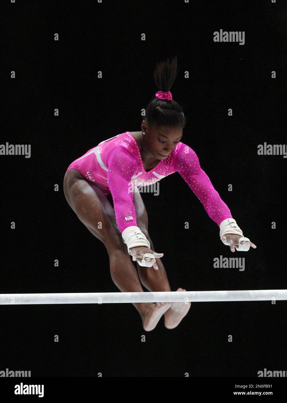 United States gymnast Simone Biles competes on the uneven bars during ...