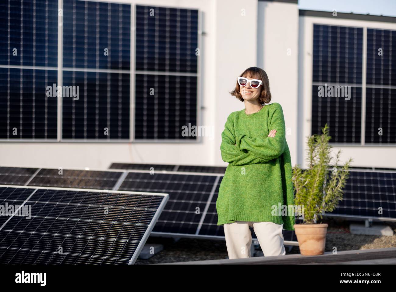 Happy house owner with a solar plant Stock Photo - Alamy