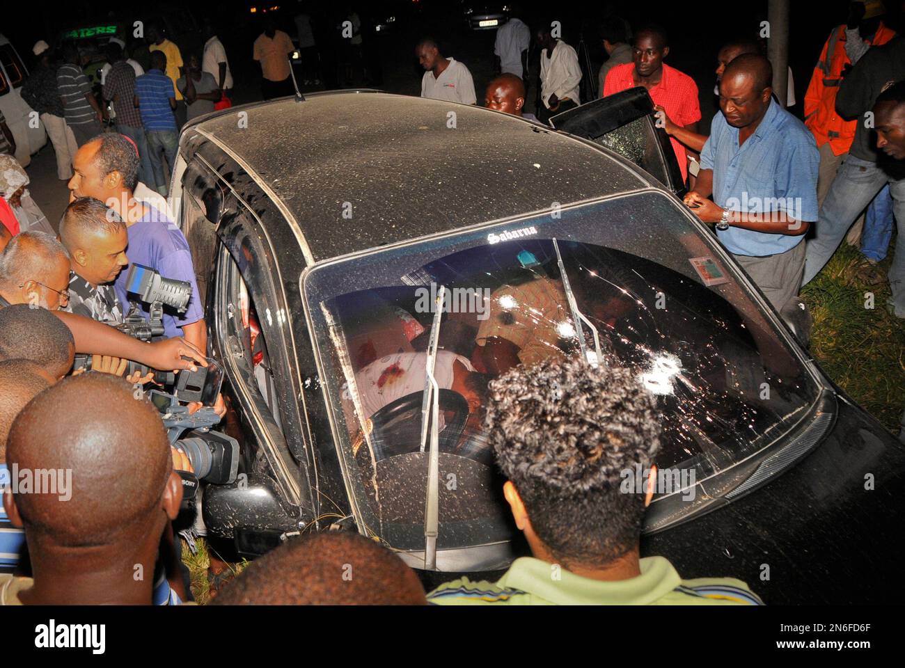 In this photo taken late Thursday, Oct. 3, 2013, media and onlookers ...