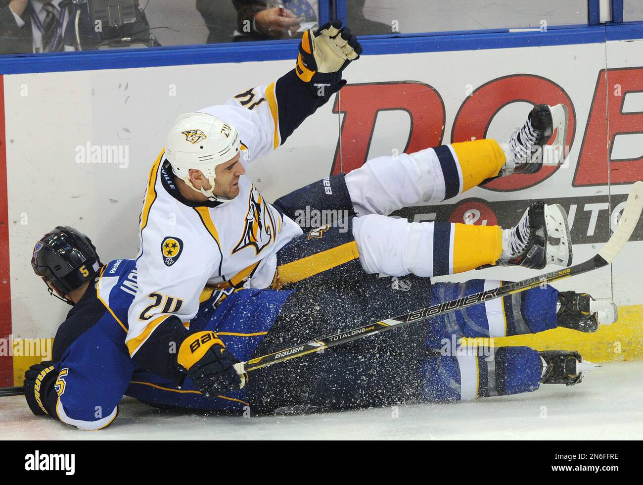 St. Louis Blues' Barret Jackman (5) slides under Nashville Predators ...