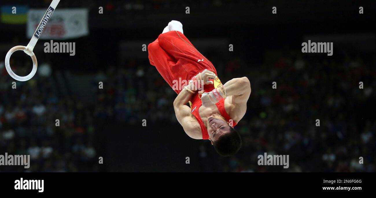 China's Lin Chaopan competes on the rings during the all-around final ...
