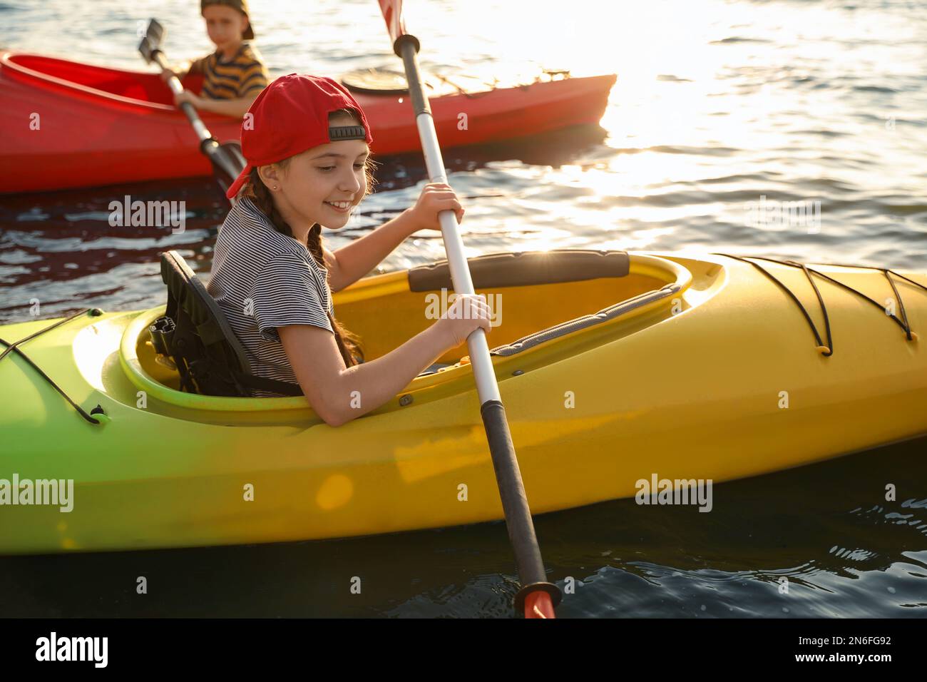 Little children kayaking on river. Summer camp activity Stock Photo - Alamy