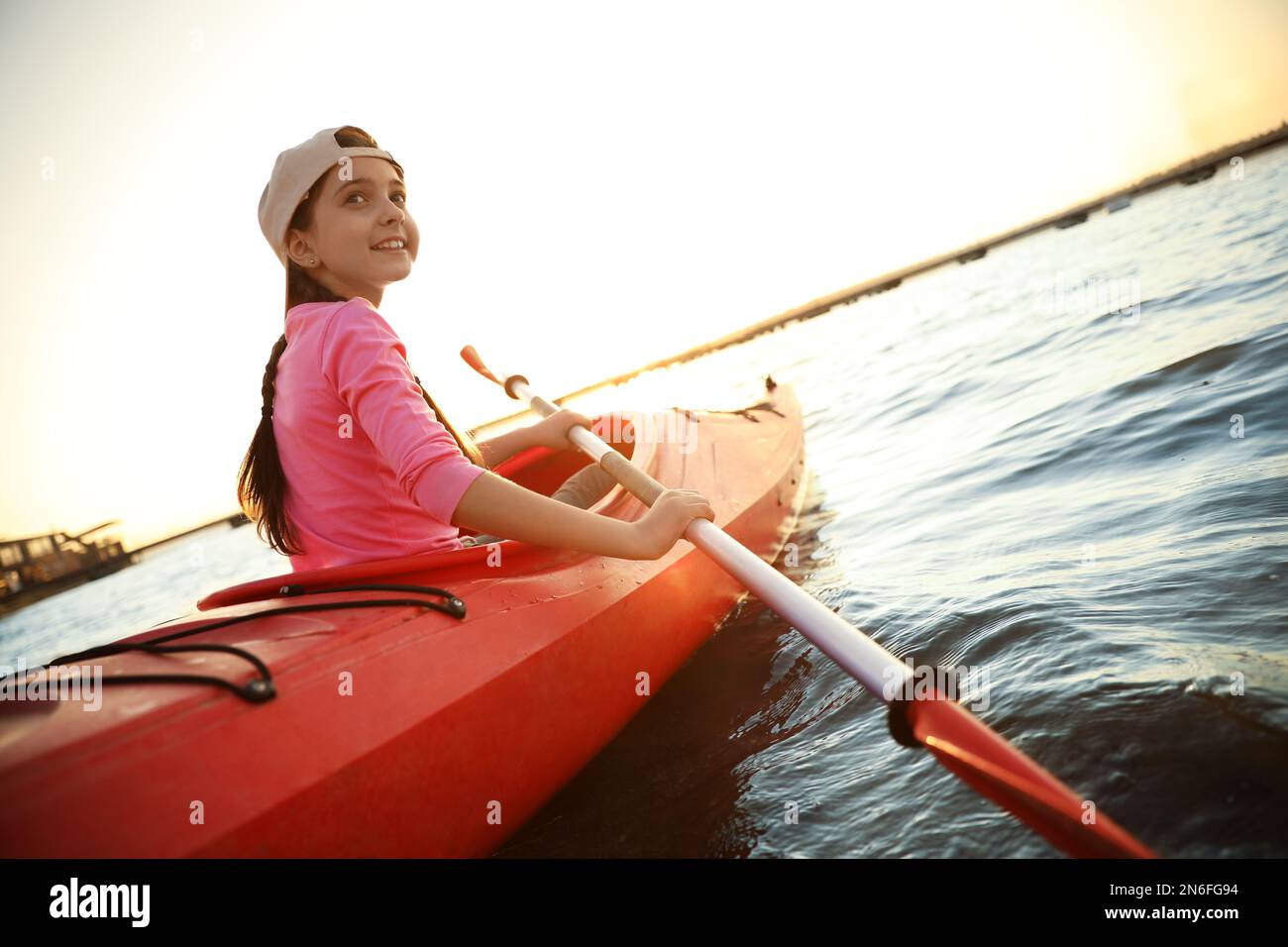 Happy girl kayaking on river. Summer camp activity Stock Photo - Alamy