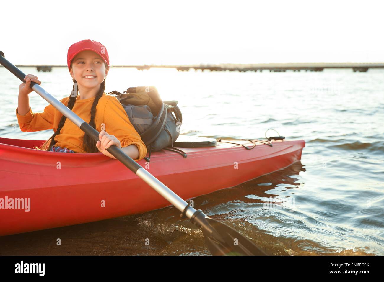Happy girl kayaking on river. Summer camp activity Stock Photo - Alamy