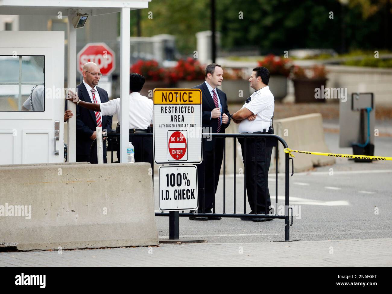 Members of the Secret Service stand outside the checkpoint entrance for ...