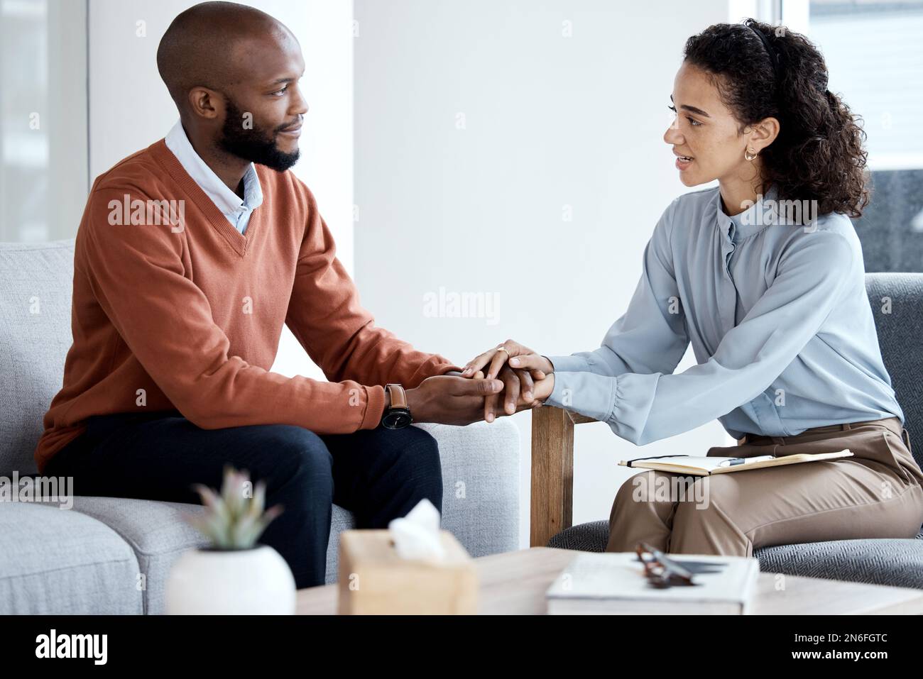 Psychology, support and black woman, psychologist or therapist holding ...