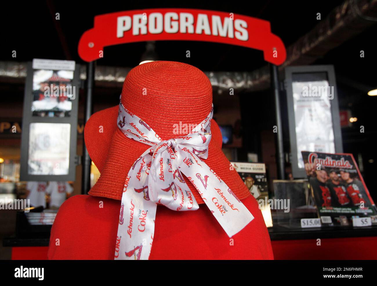 St. Louis Cardinals fan Jane Lanser looks over souvenirs before Game 1 ...