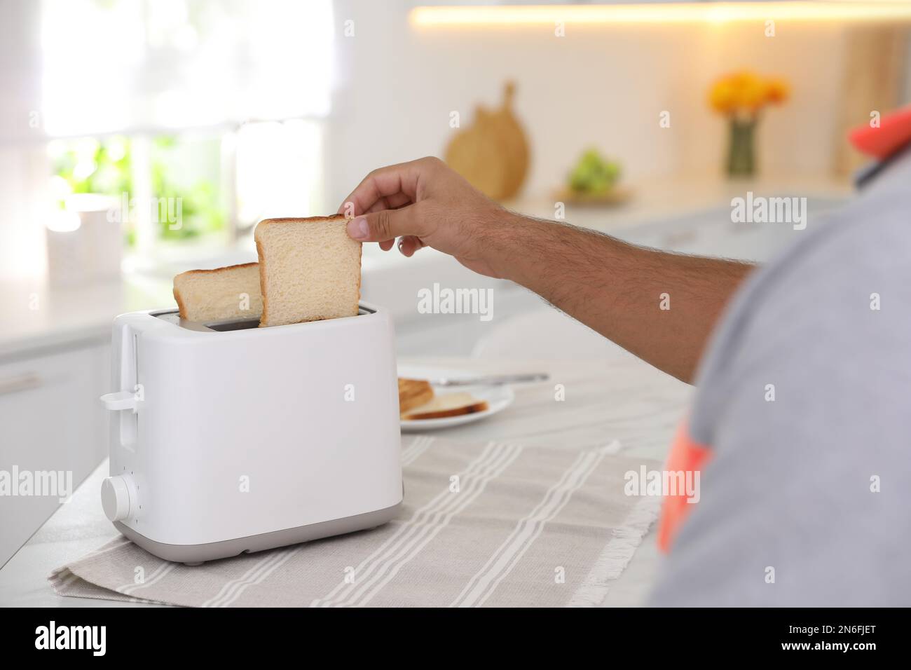Man using toaster table hi-res stock photography and images - Alamy
