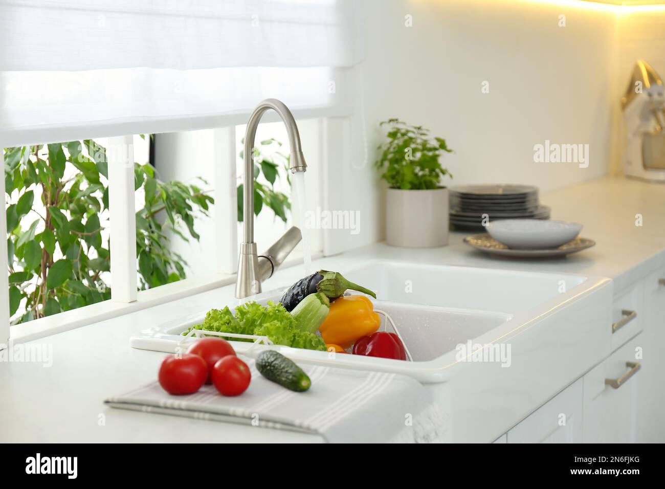 Many fresh ripe vegetables under tap water in kitchen sink Stock Photo ...