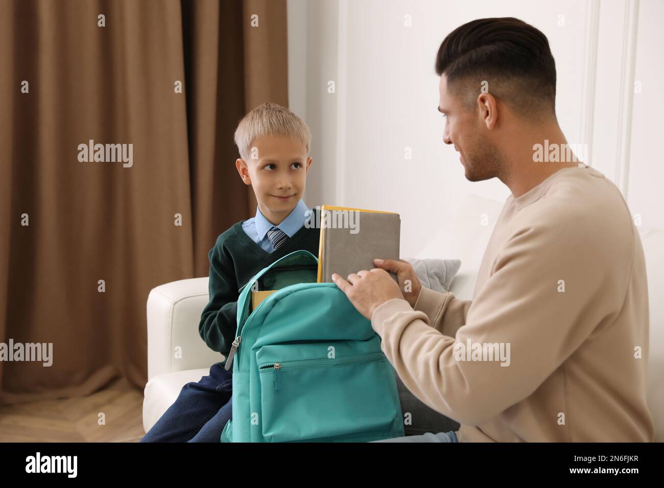 Child school uniform adult home hi-res stock photography and images - Alamy