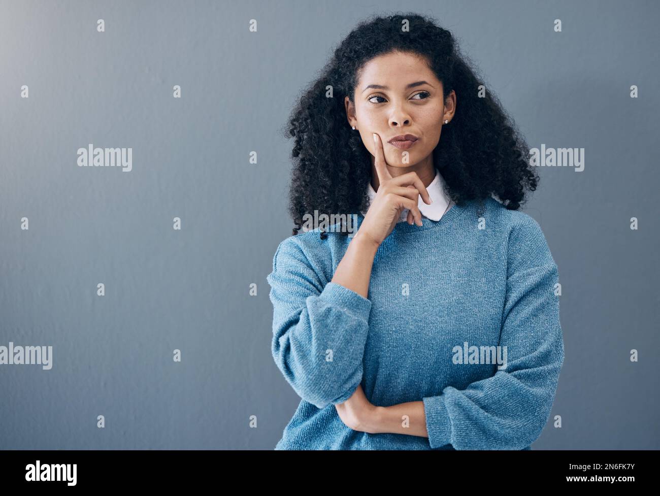 Thinking, thoughtful and woman in a studio with an idea, smart question ...