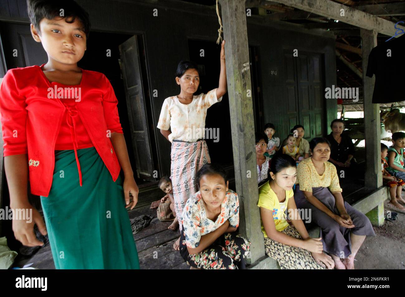 Kaman Muslims, whose home was burned down during Tuesday's violence ...