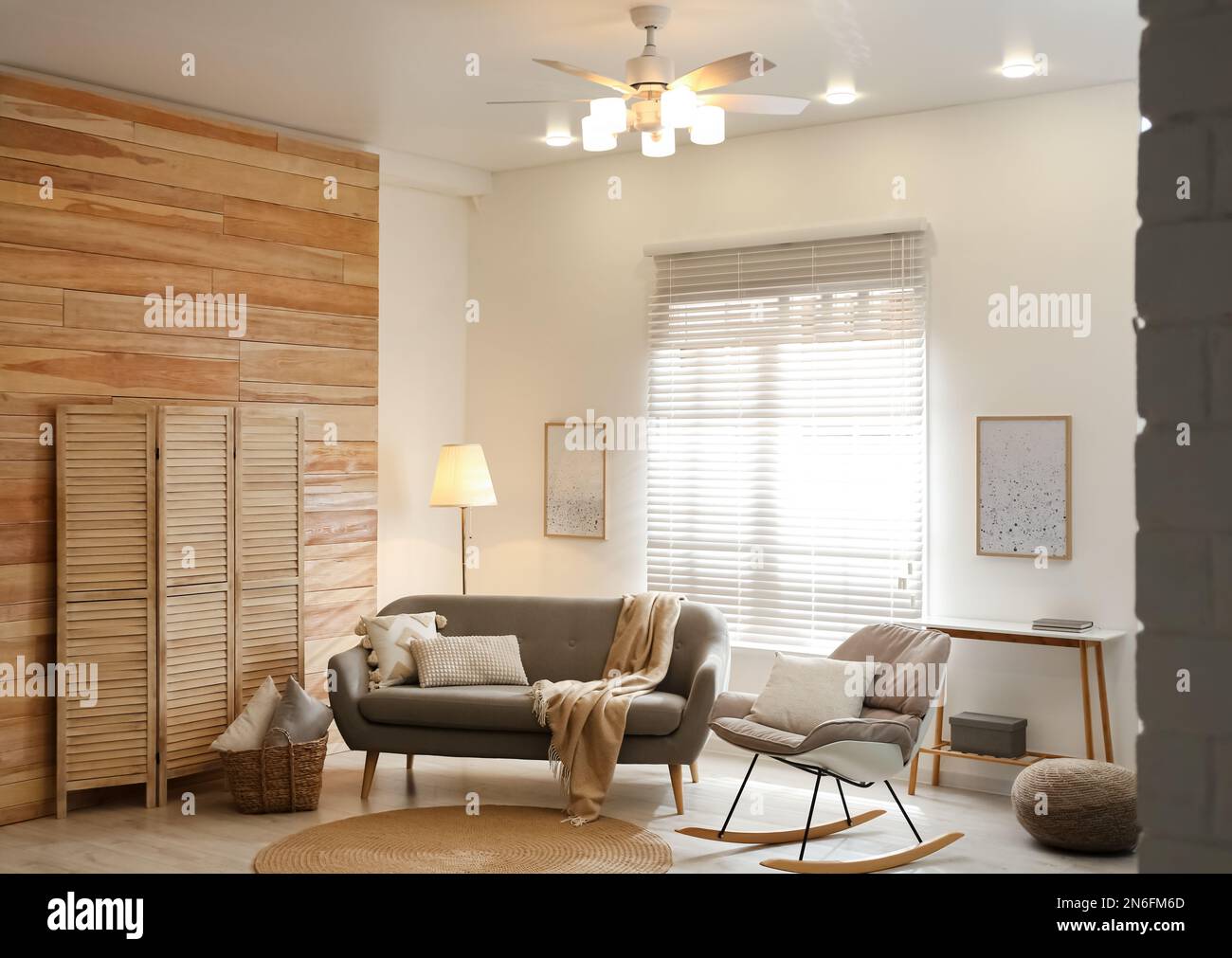 Stylish living room interior with modern ceiling fan and comfortable ...