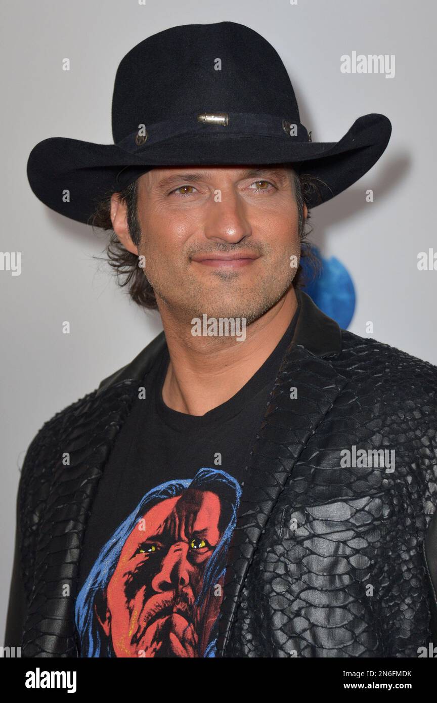 Robert Rodriguez arrives at the premiere of "Machete Kills" at Regal ...