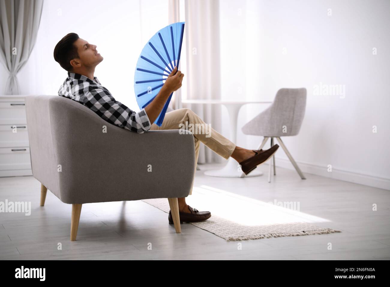 Man sitting on cooler hi-res stock photography and images - Alamy