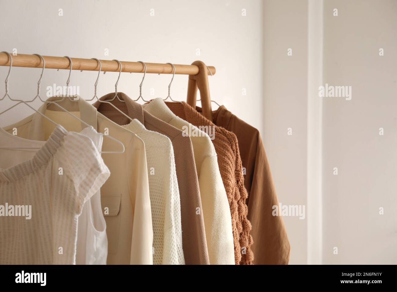 Rack with stylish women's clothes indoors. Modern interior design Stock ...