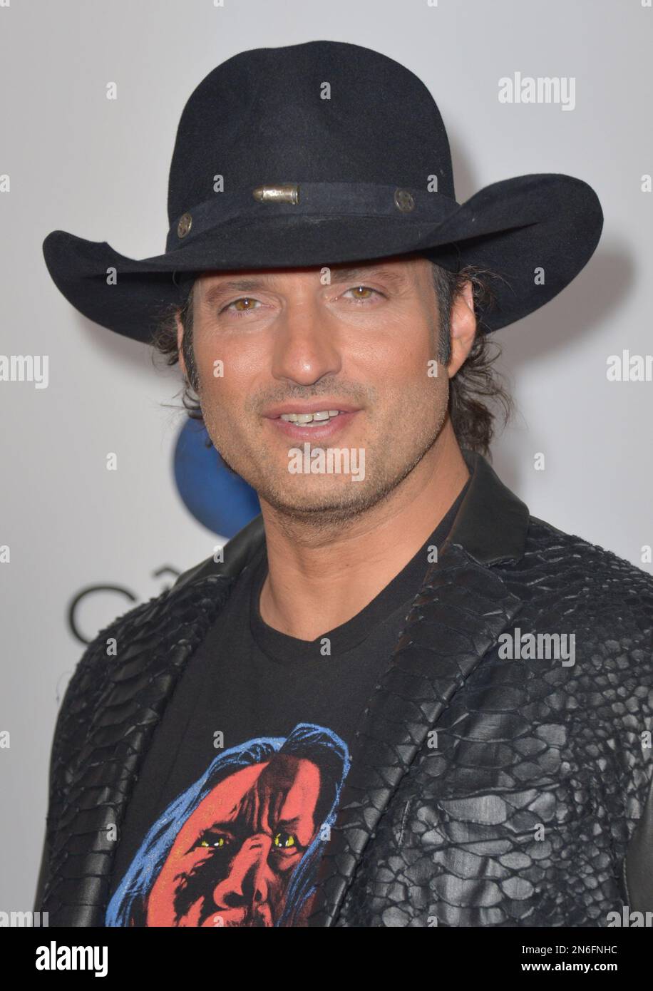 Director Robert Rodriguez arrives at the premiere of "Machete Kills" at ...