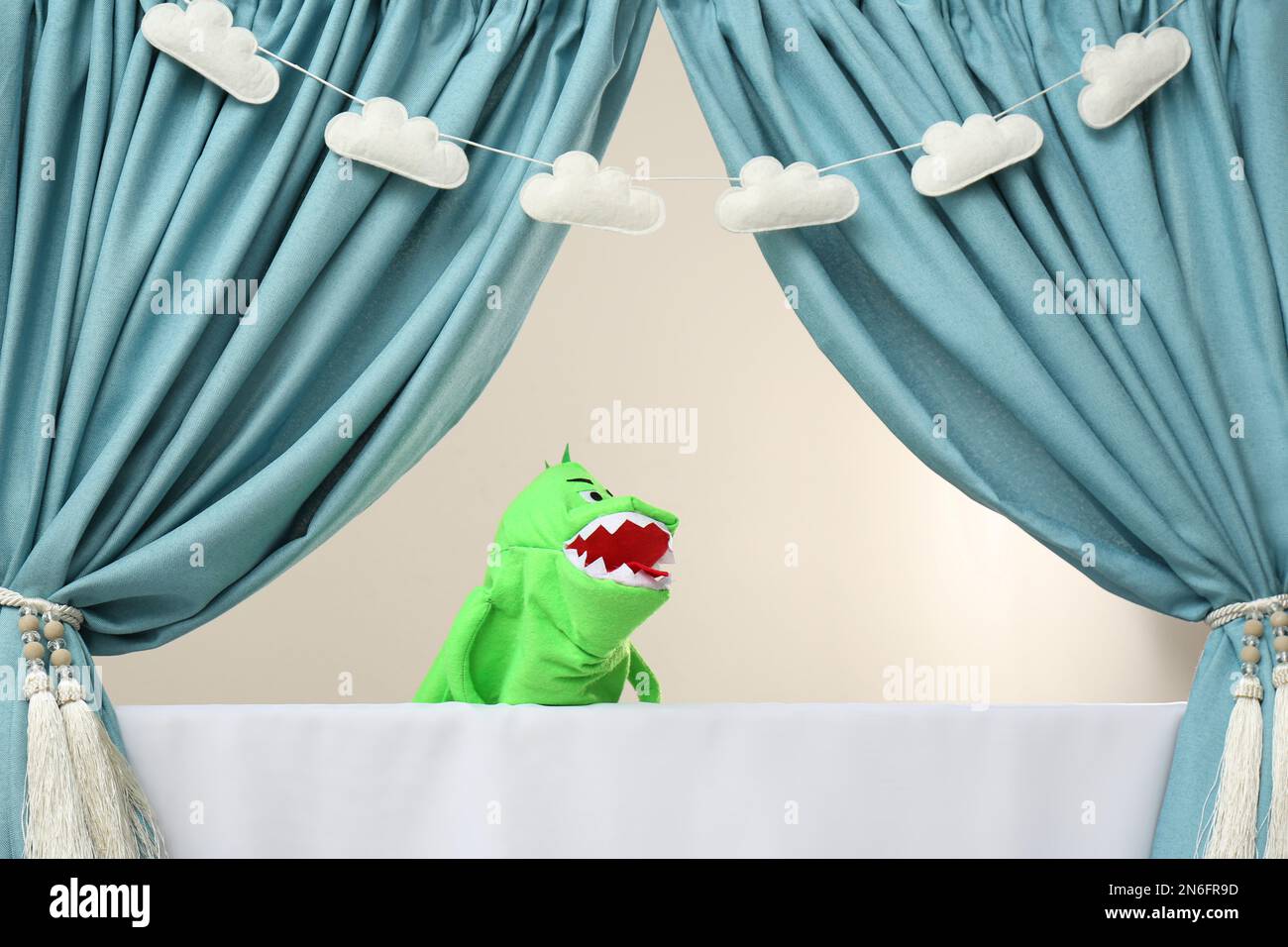 Creative puppet show on white stage indoors Stock Photo - Alamy