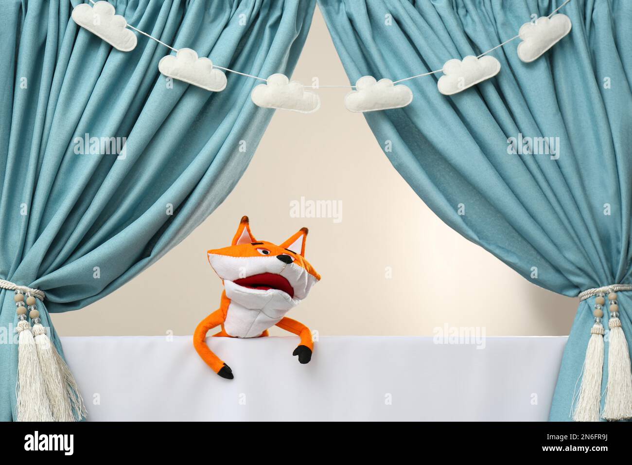 Creative puppet show on white stage indoors Stock Photo - Alamy