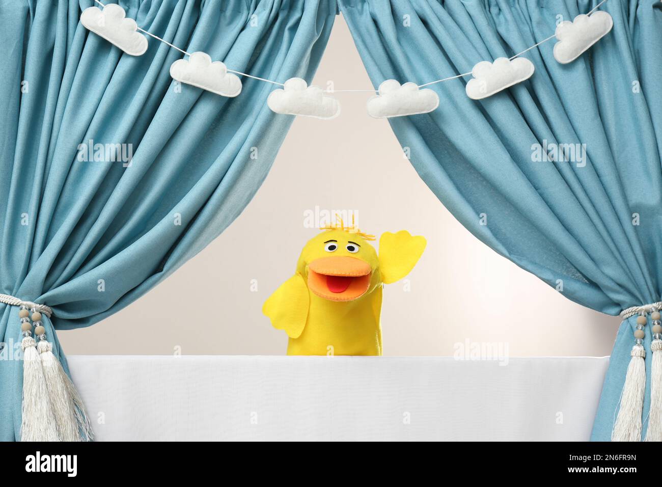 Creative puppet show on white stage indoors Stock Photo - Alamy