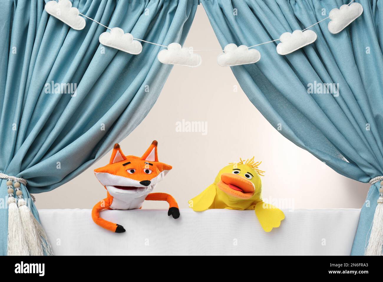 Creative puppet show on white stage indoors Stock Photo - Alamy
