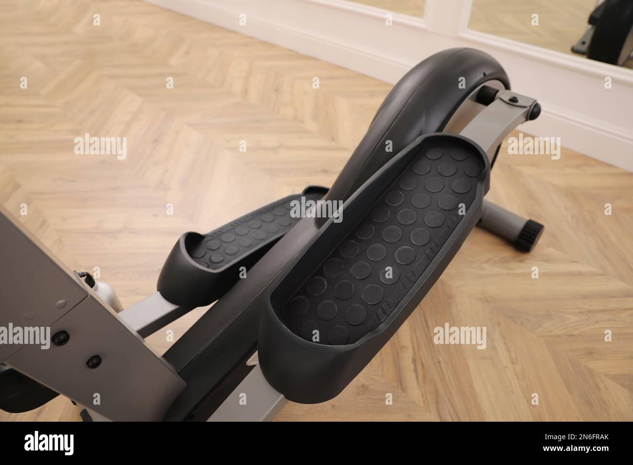 Modern elliptical machine cross trainer on floor indoors Stock Photo ...