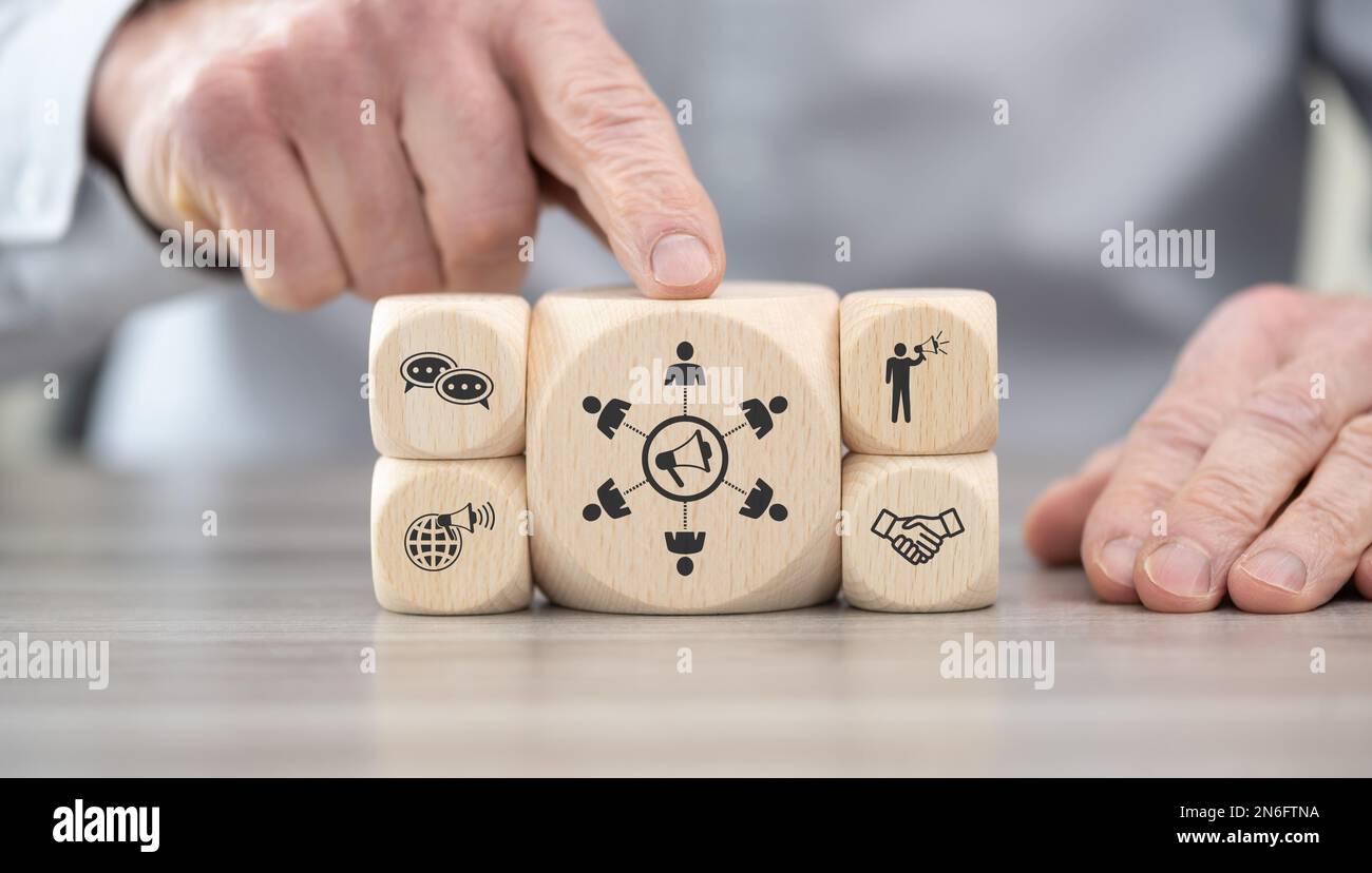 Wooden blocks with symbol of public relations concept Stock Photo - Alamy