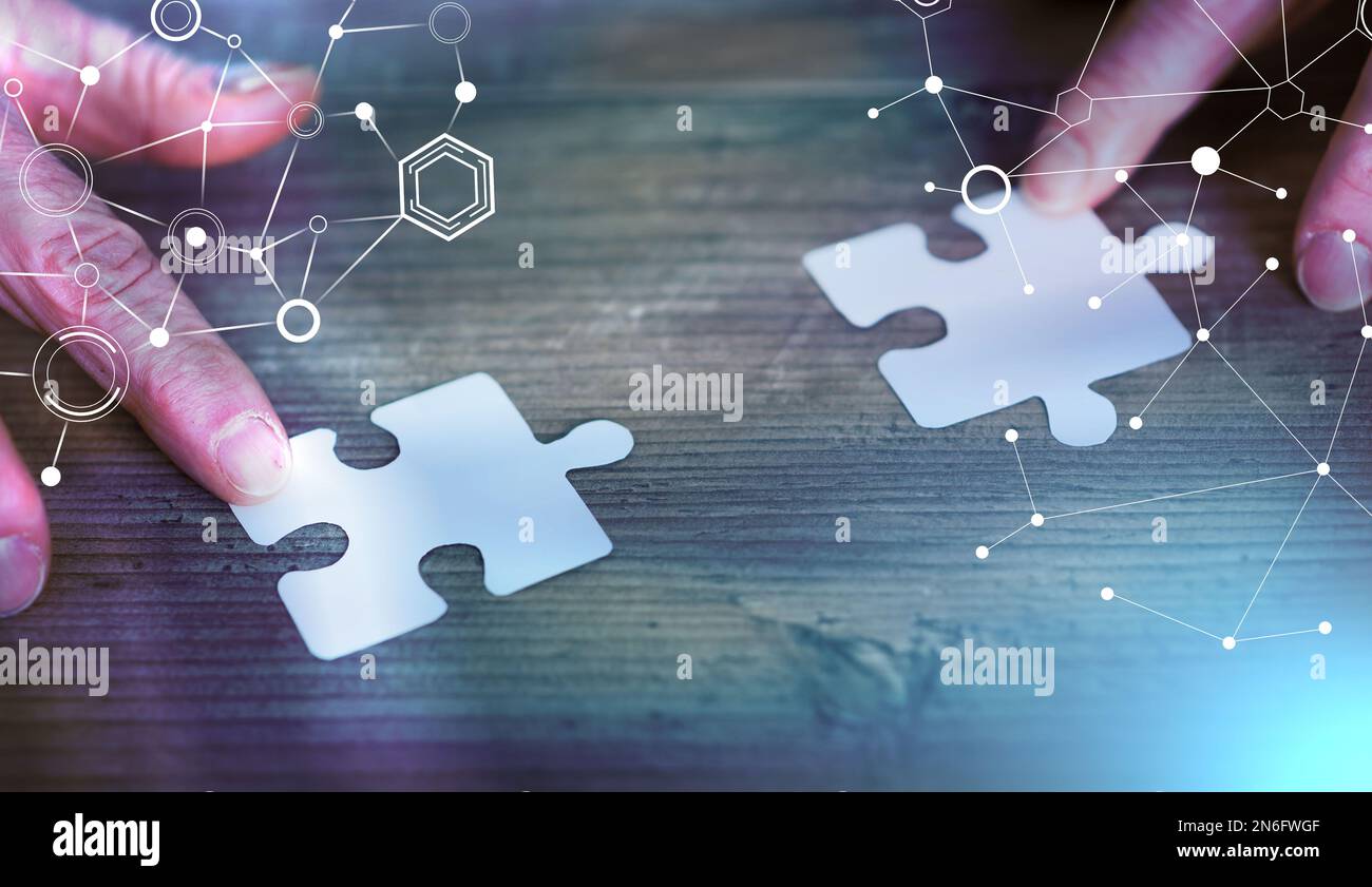 Hands joining two puzzle pieces, teamwork concept; light effect Stock ...