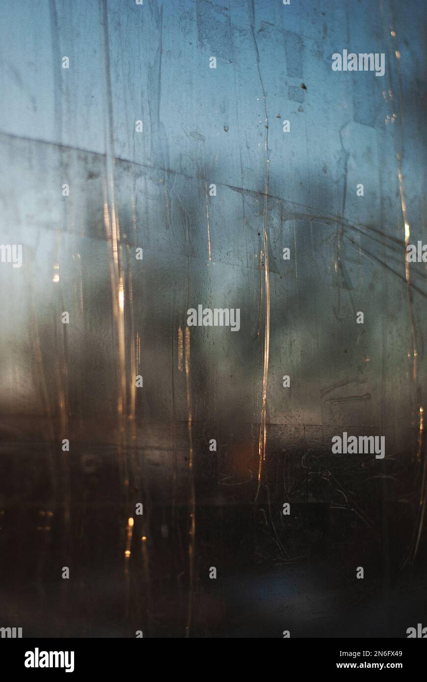 Details of windows in a train in the morning light Stock Photo - Alamy
