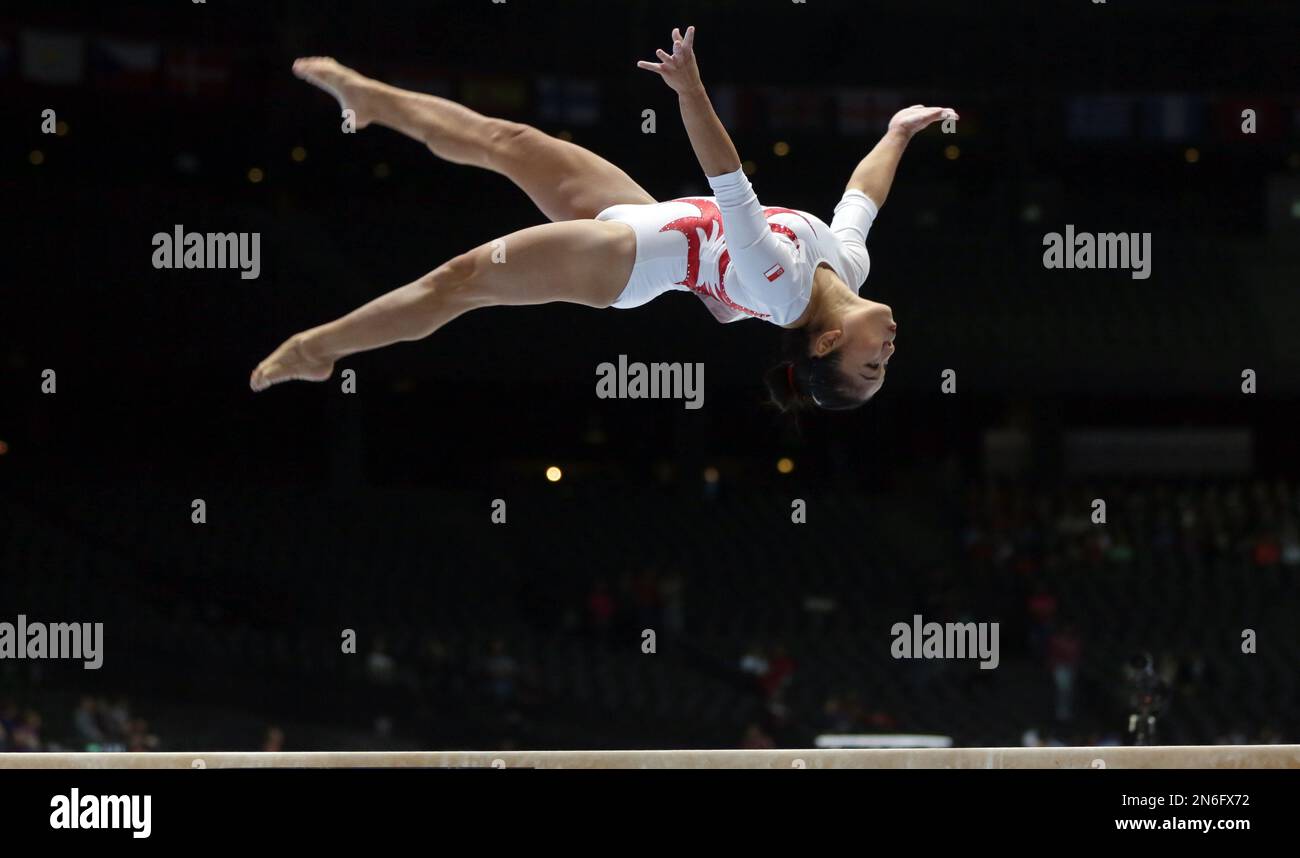 Singapore's Heem Wei Lim competes on the balance beam during a ...