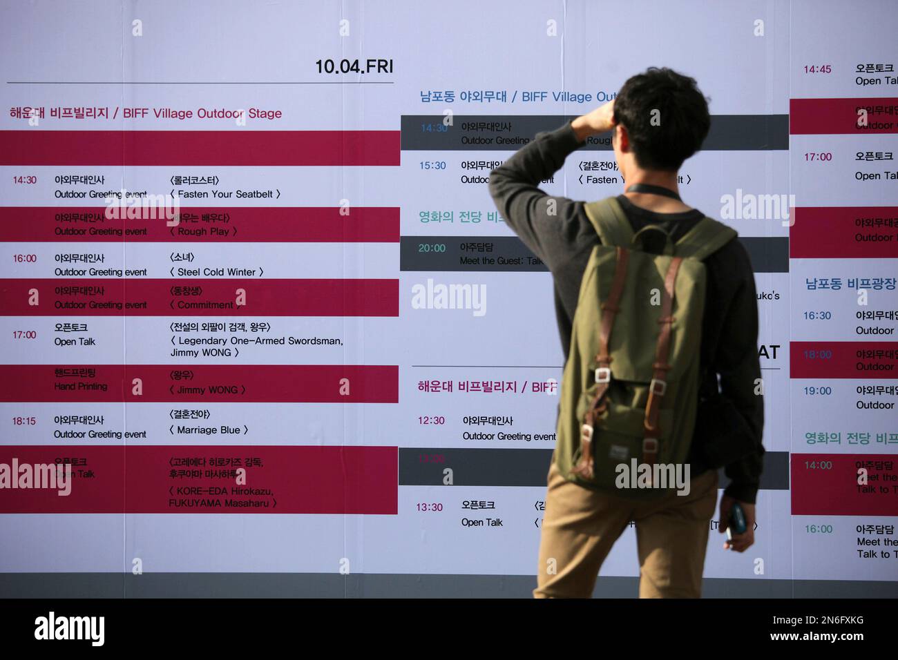 A South Korean man looks at the time table of the Busan International ...
