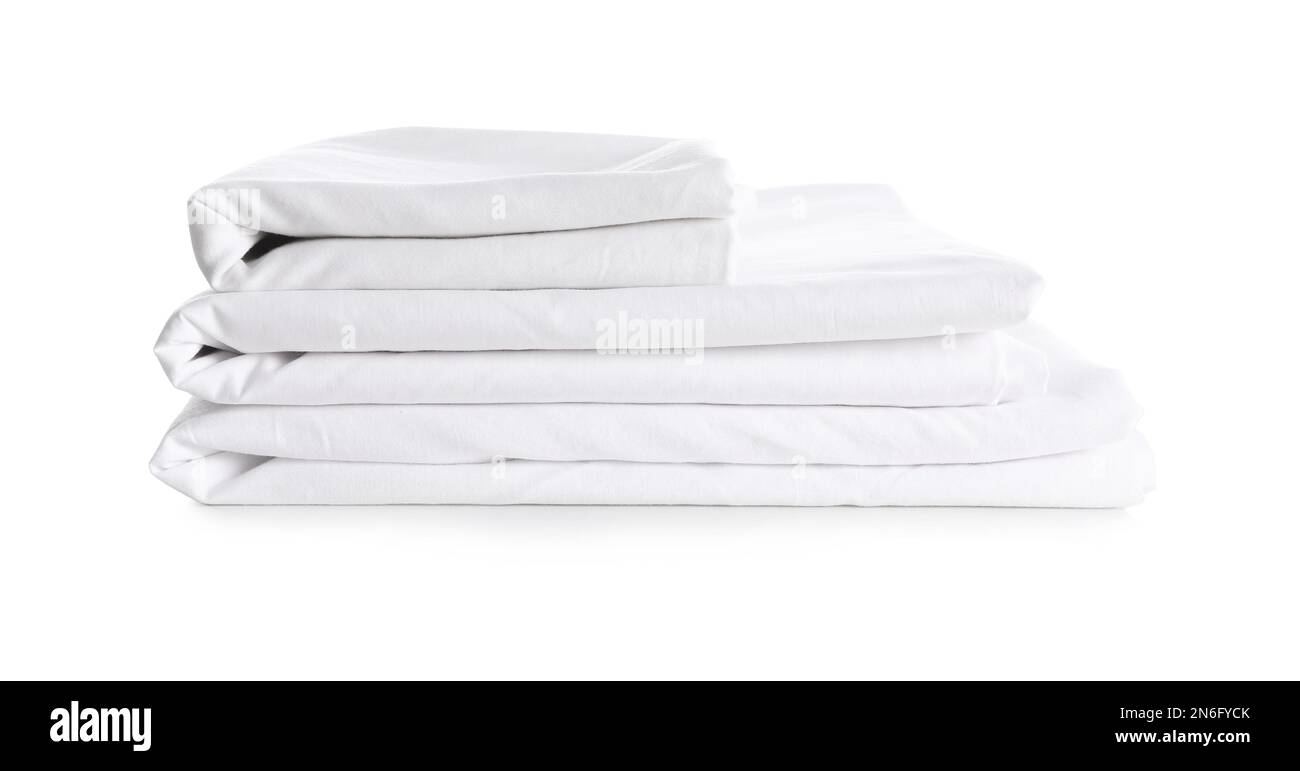 Stack of clean bed linen isolated on white Stock Photo - Alamy