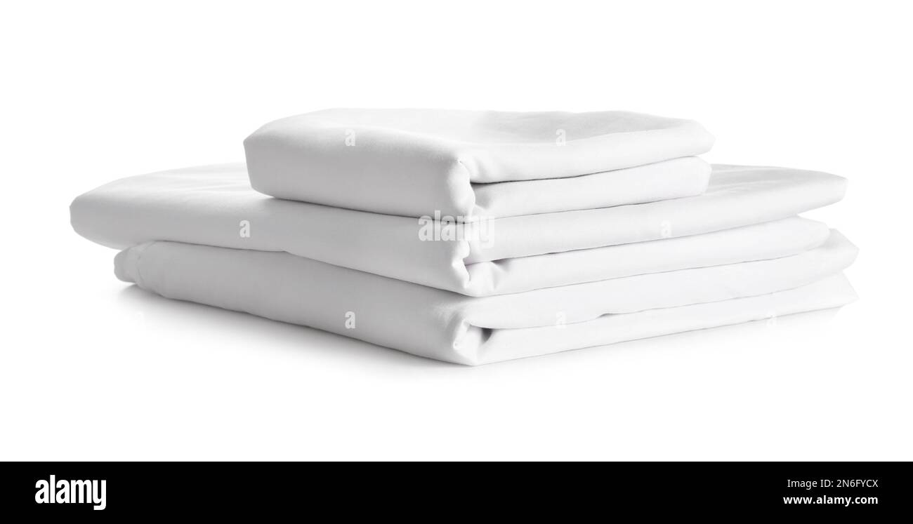 Stack of clean bed linen isolated on white Stock Photo - Alamy