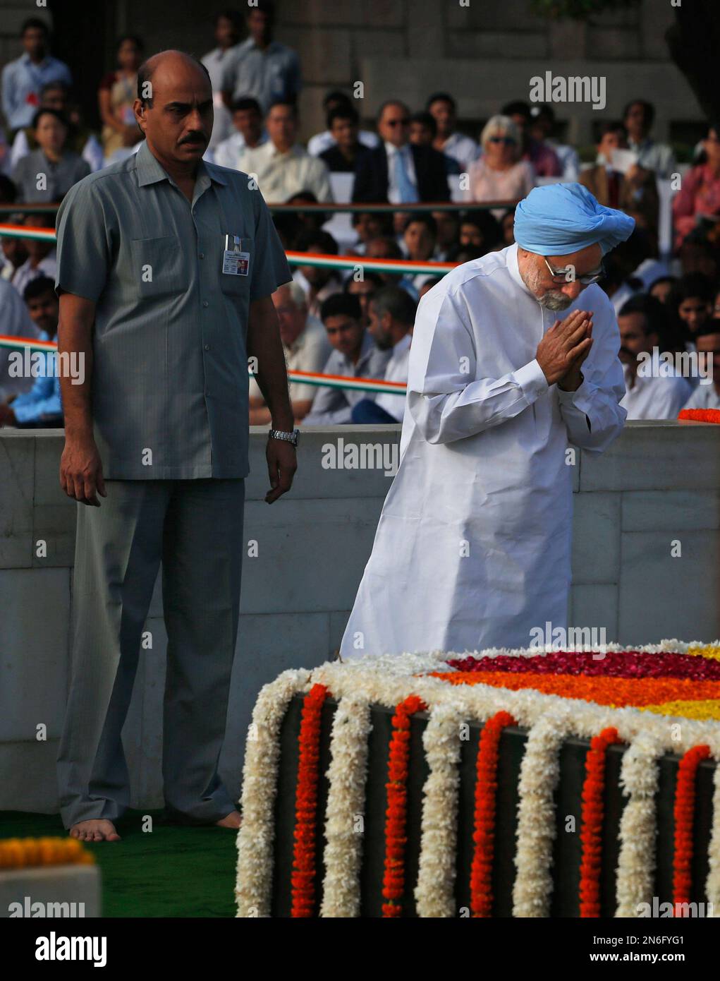A Special Protection Group (SPG) police officer stands behind as Indian ...