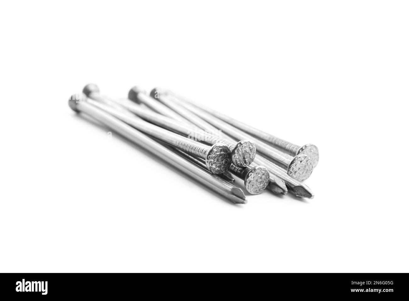 Pile of metal nails on white background Stock Photo - Alamy