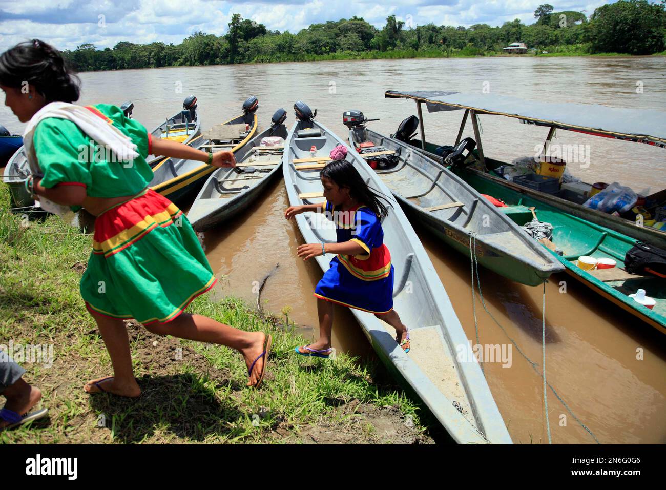 Siona Indian girls arrive by boat to an area known as Playas de ...