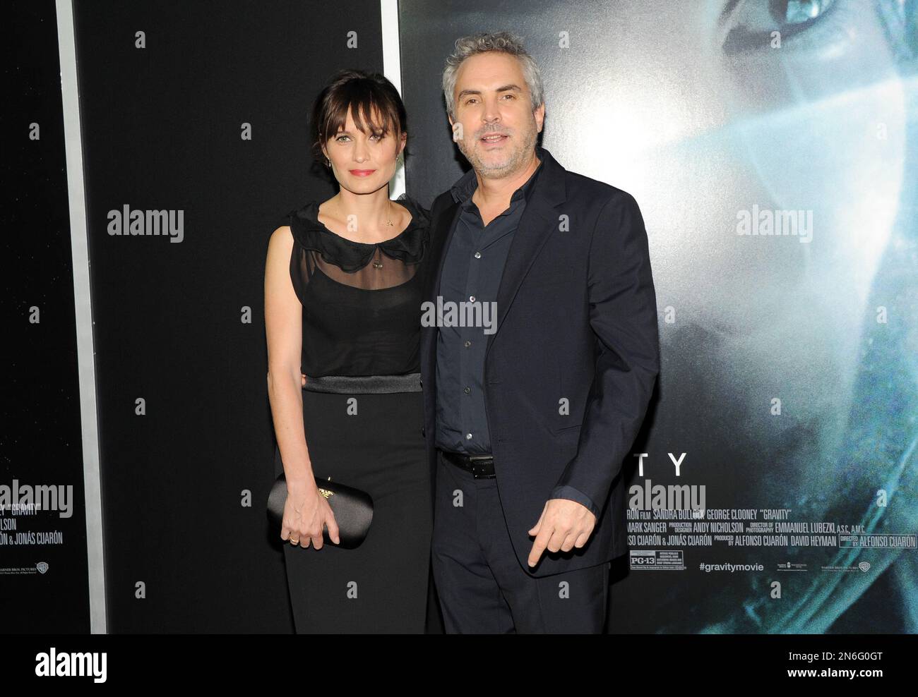 Director Alfonso Cuaron and girlfriend Sheherazade Goldsmith attend the ...