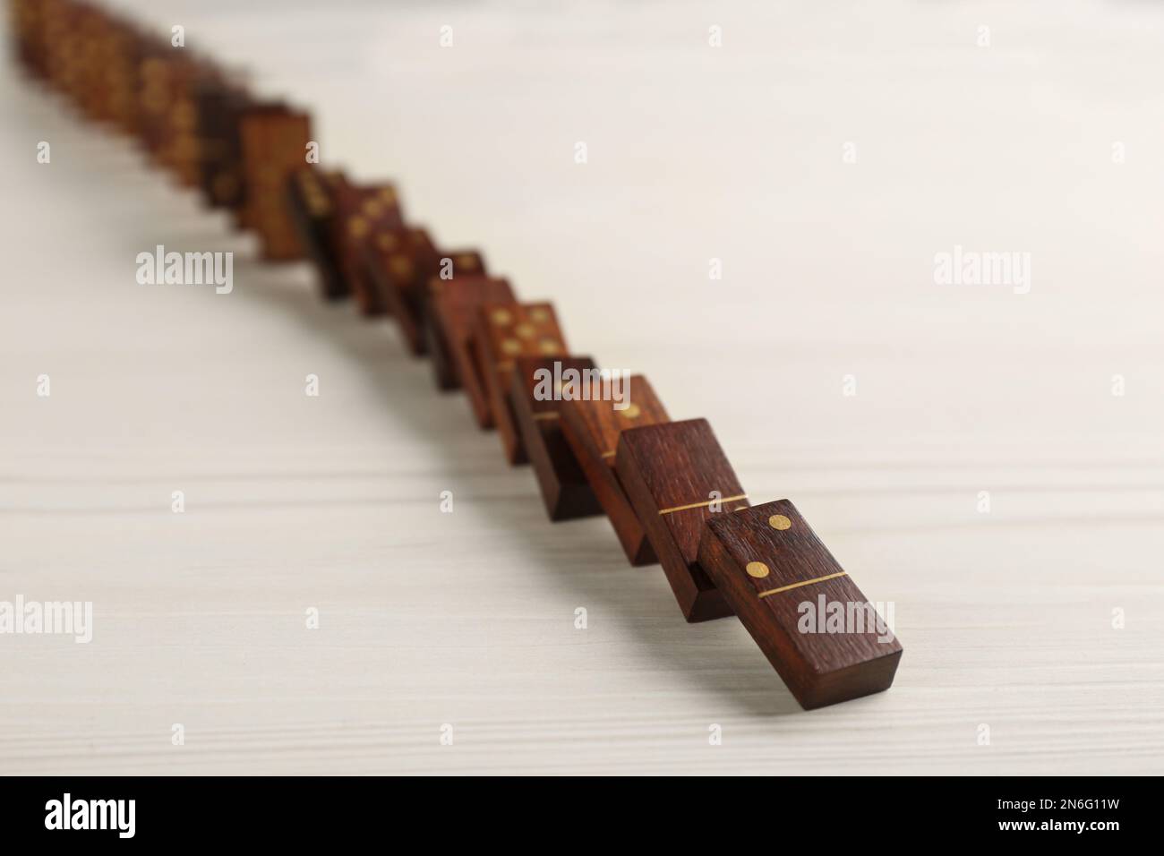 Domino effect falling chain sequence hi-res stock photography and ...