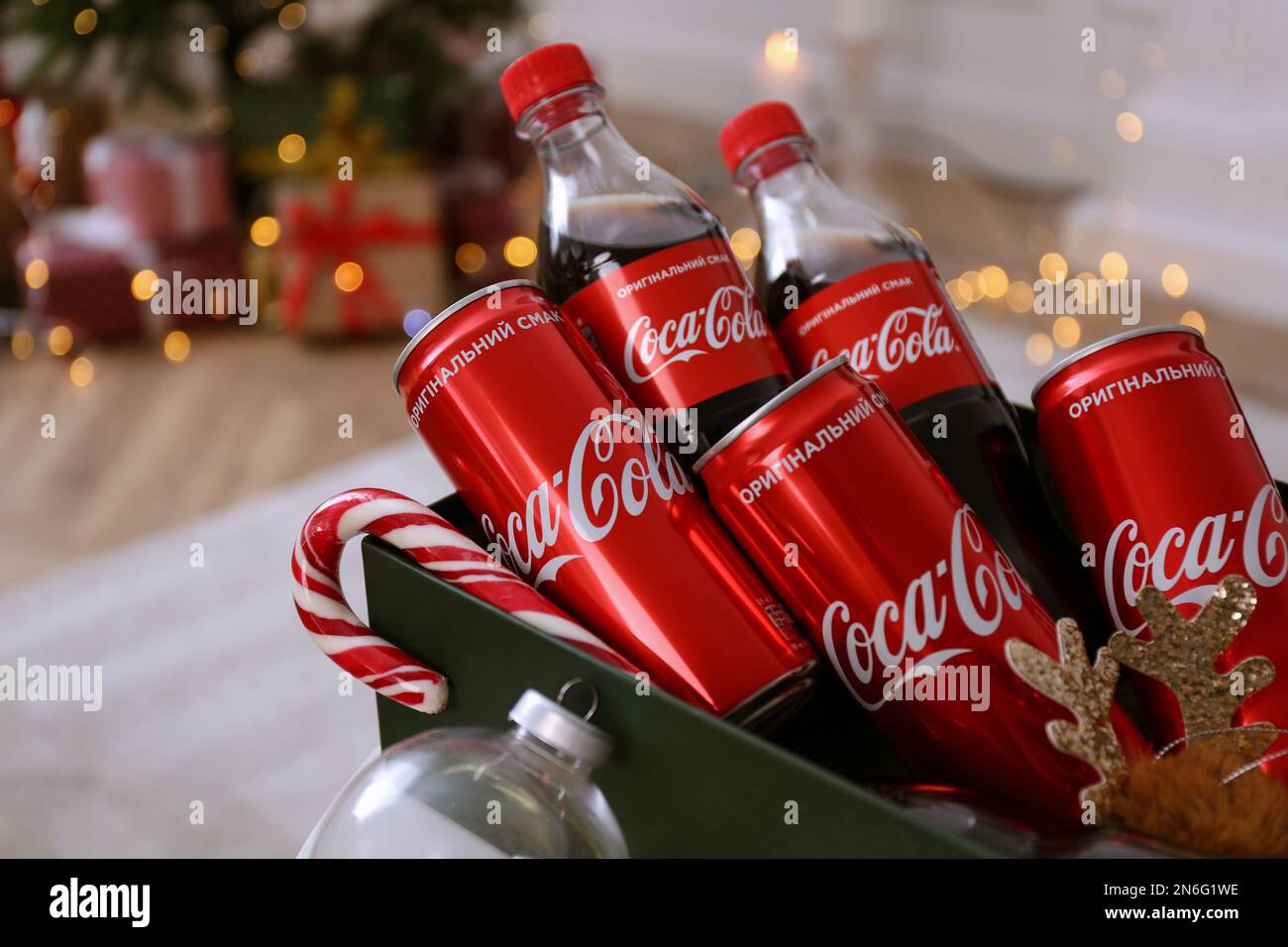 MYKOLAIV, UKRAINE - JANUARY 13, 2021: Coca-Cola bottles and cans in box ...