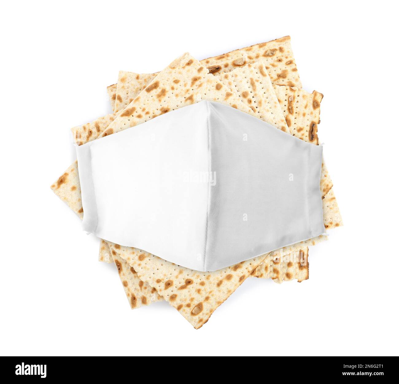 Coronavirus pandemic. Passover matzos and protective face mask on white ...