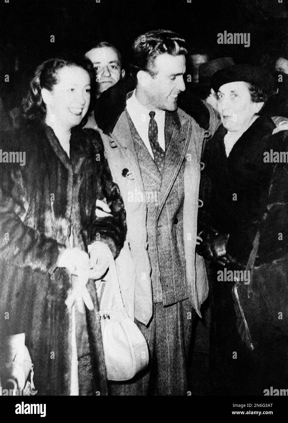 Danielle Darrieux, left, French film actress, arrives at the Gare de ...