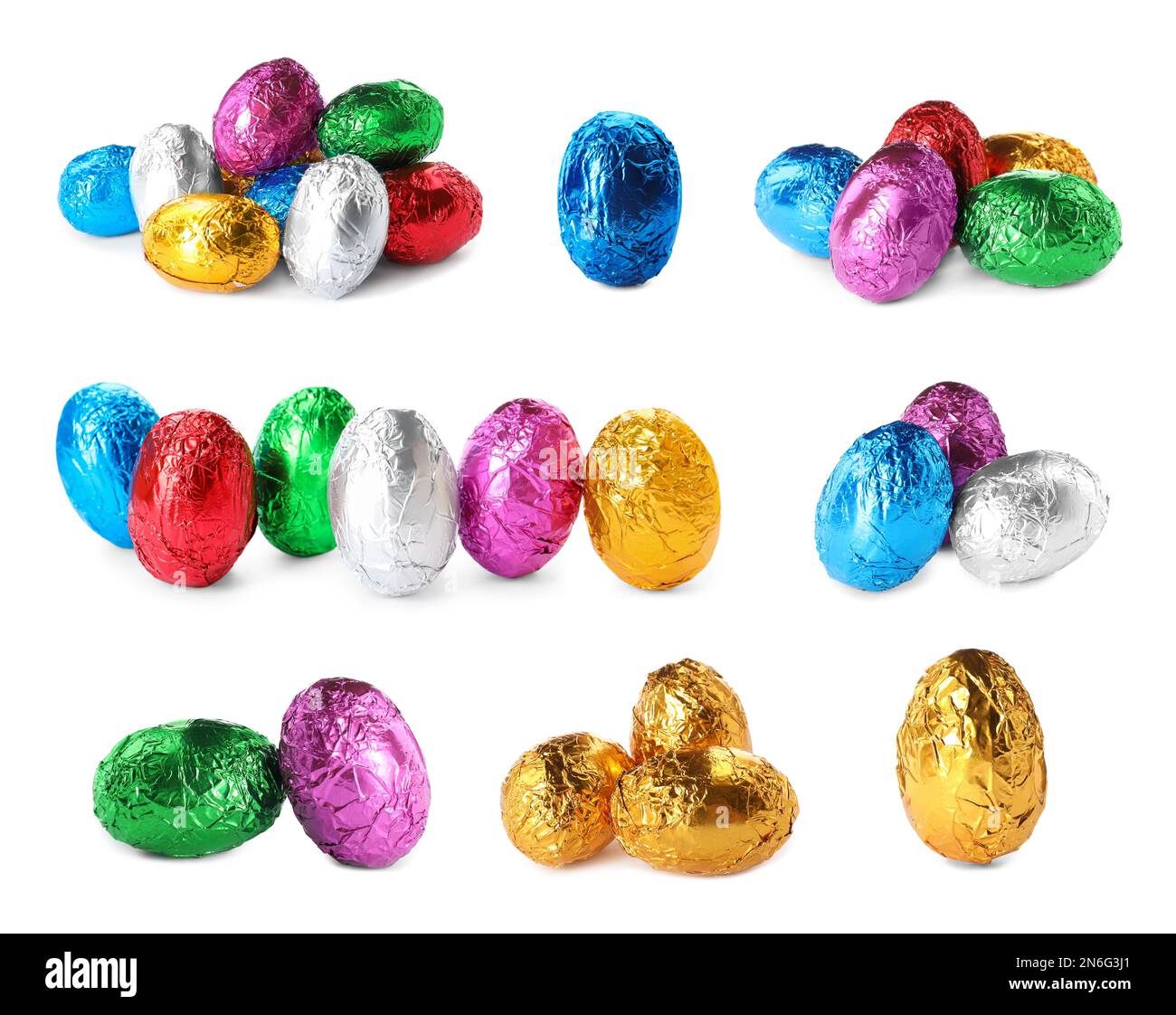 Set with chocolate eggs wrapped in bright foil on white background ...